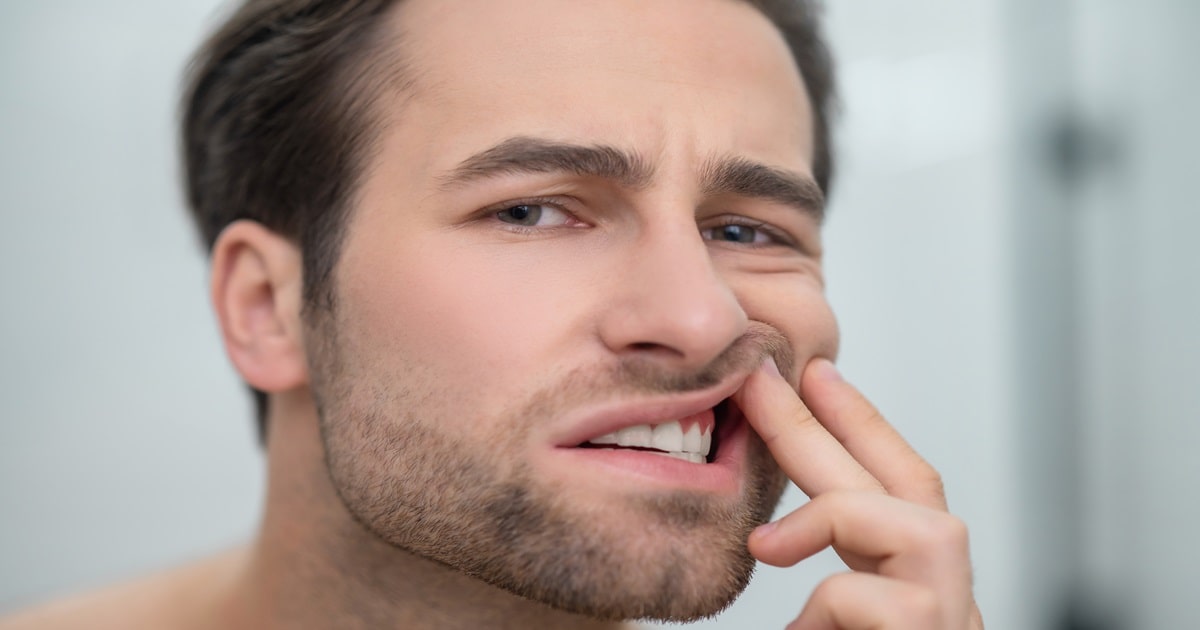 Exposed Tooth Root Pictures | What to Look For + Signs
